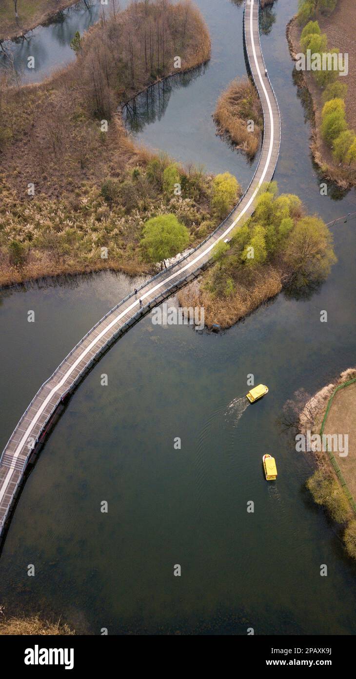 YANGZHONG, CHINA - MARCH 11, 2023 - People visit a riverside park in ...