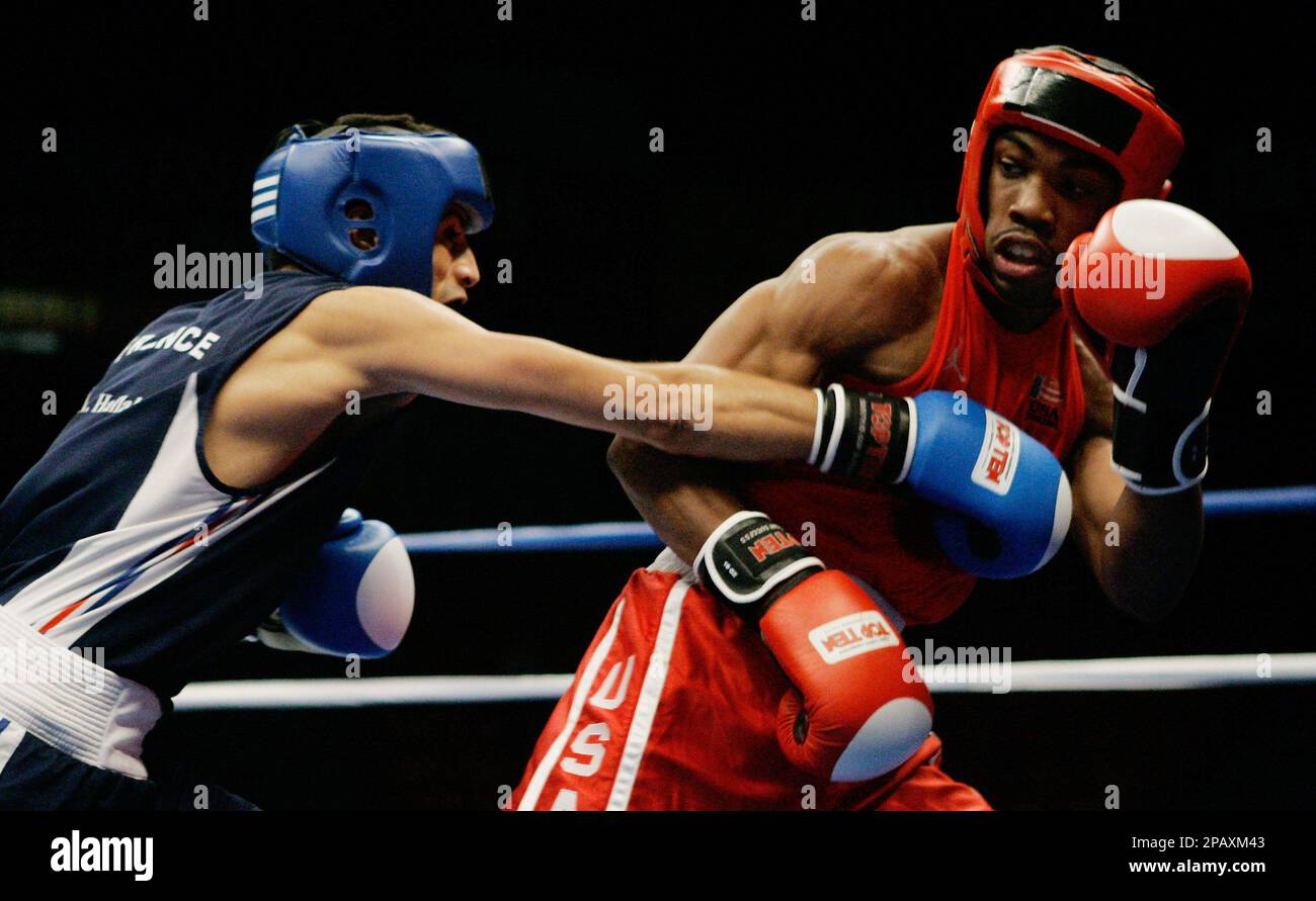 Ali Hallab, left, of France, throws a punch at Gary Russell, of the ...