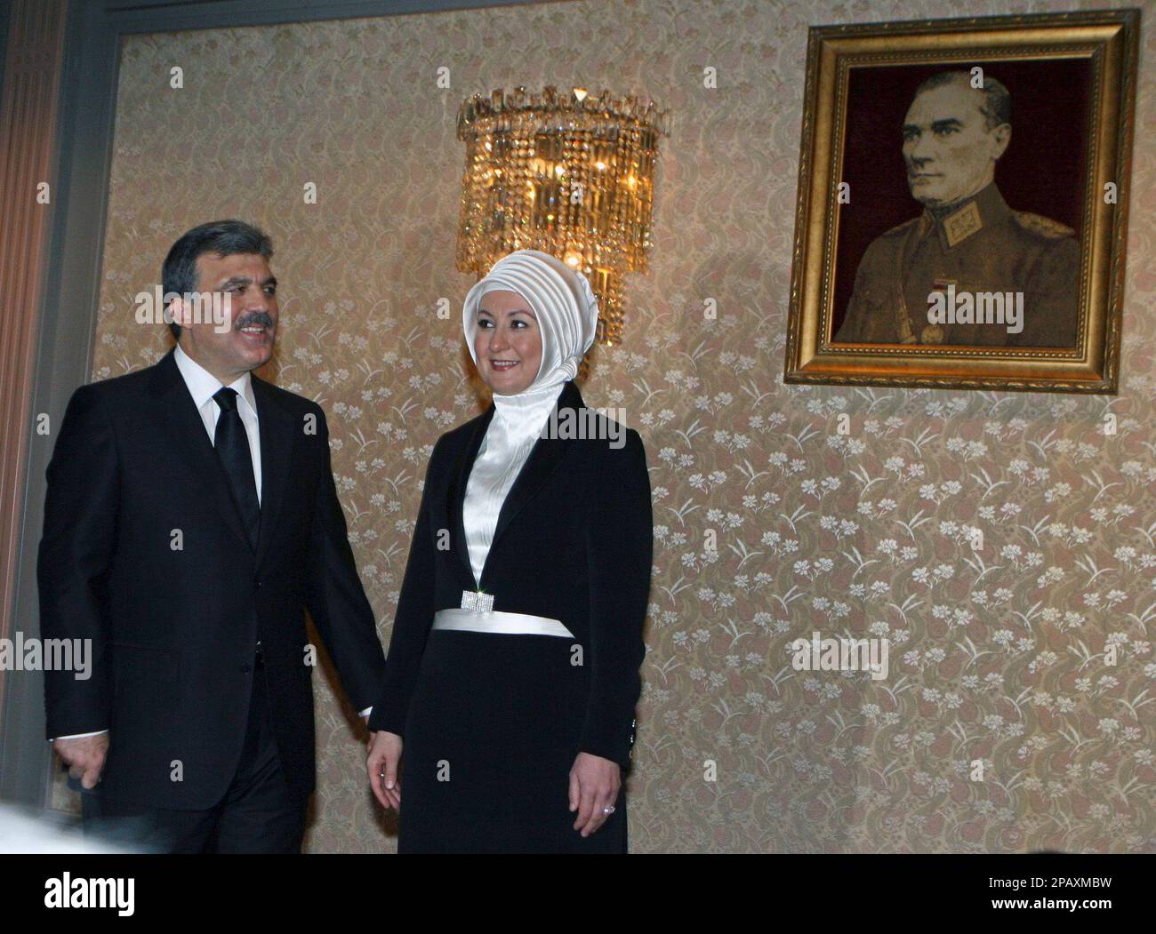 Turkish President Abdullah Gul and his wife Hayrunnisa Gul wait for ...