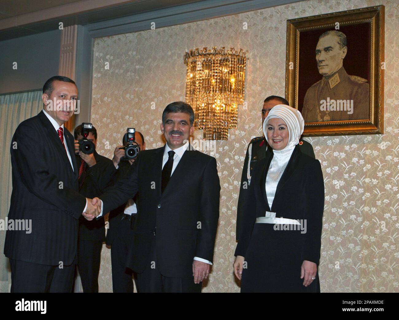 Turkish President Abdullah Gul, center, his wife Hayrunnisa Gul, and ...