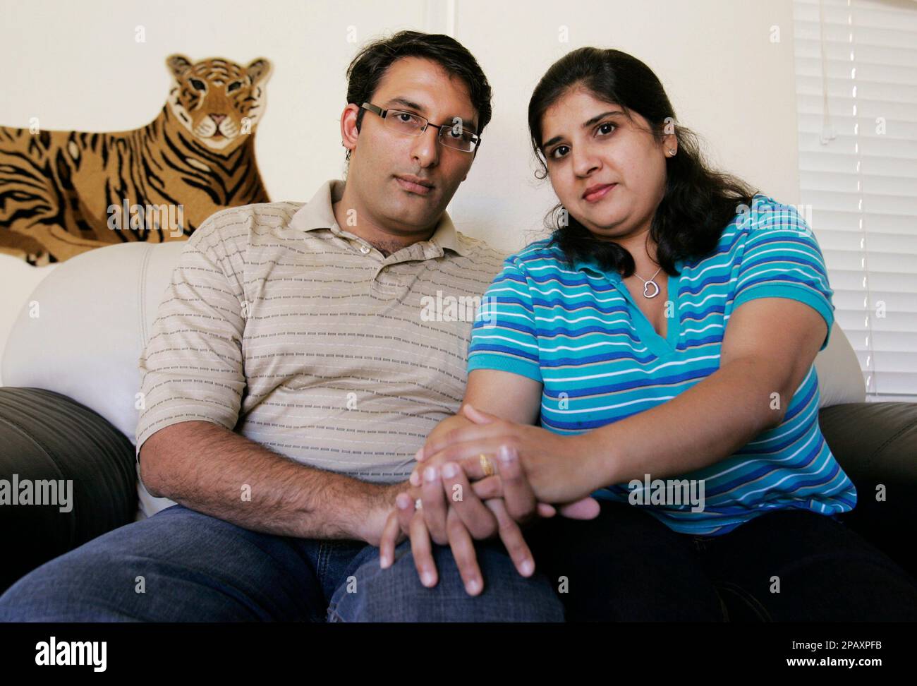 Sandeep and Preeti Bhatia are seen at their home in San Jose, Calif ...