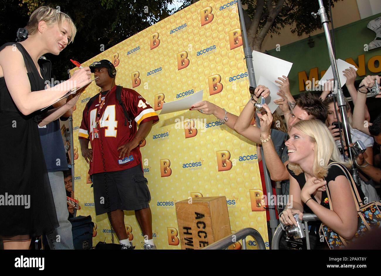 Actress Renee Zellweger signs an autograph for a fan at the Los Angeles ...