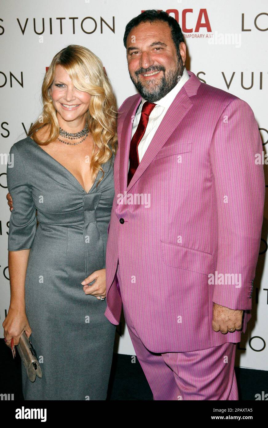 Producers Karyn Fields, left and Joel Silver arrive at the Louis ...