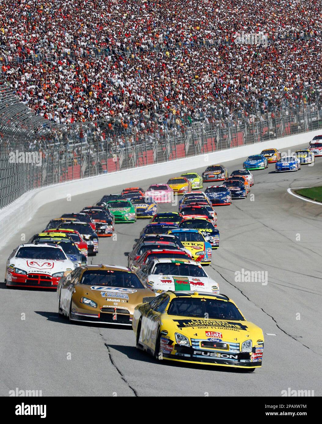 Pole-sitter Greg Biffle leads the pack to the start lines as the Pep ...