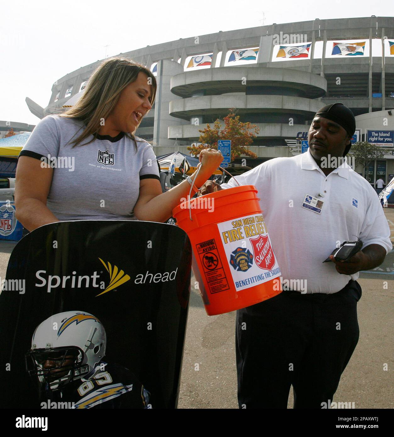 Heidi Schutte, left, collects a donation from parking lot attendant ...