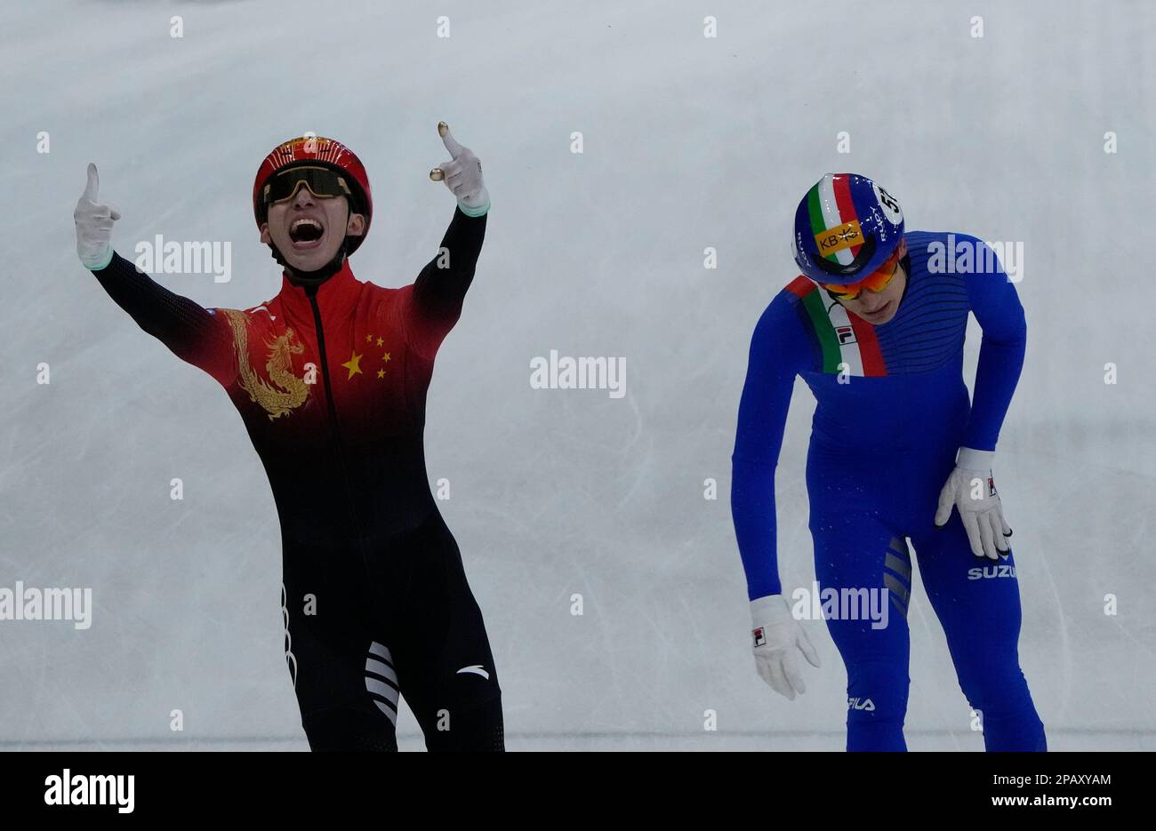 Lin Xiaojun, left, of China celebrates after winning the men's 5,000 ...