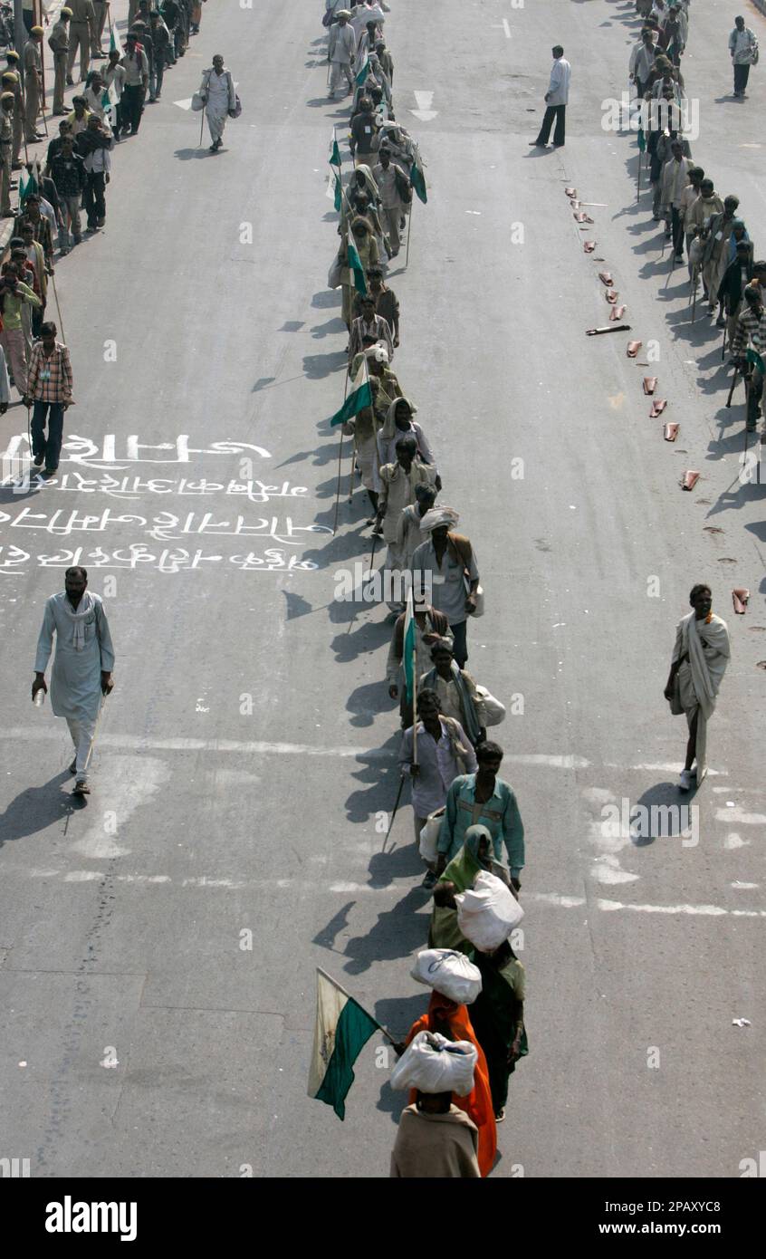 Protestors march through a street in New Delhi, India, Sunday, Oct. 28 ...