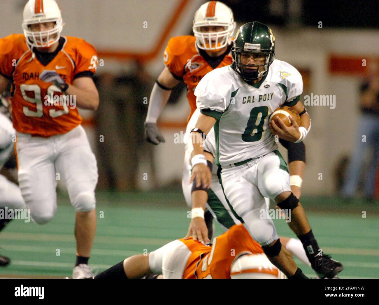 Cal Poly quarterback Jonathan Dailey (8) is pursued by Idaho State ...
