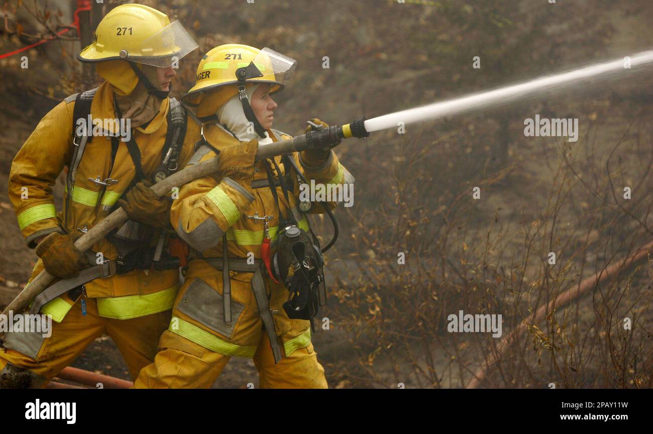 Debbie Clevenger, right, and Paul Hartman of the Arrowbear Fire Dept ...