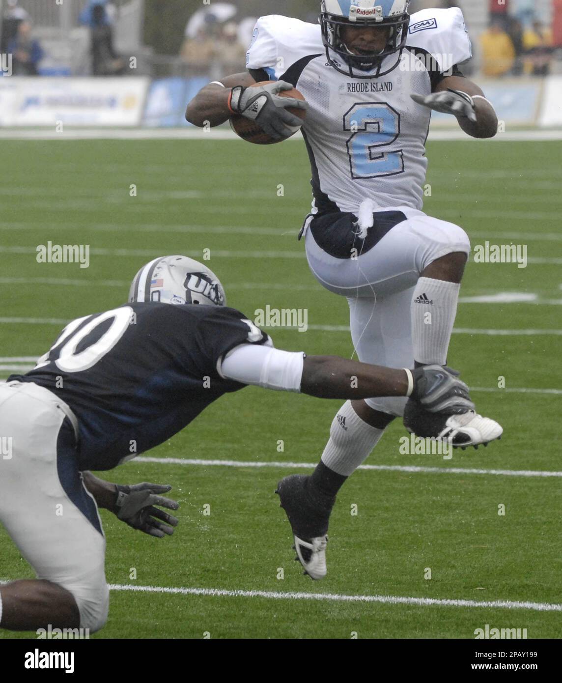 Rhode Island running back Jerell Jones, right, attempts to leap over ...