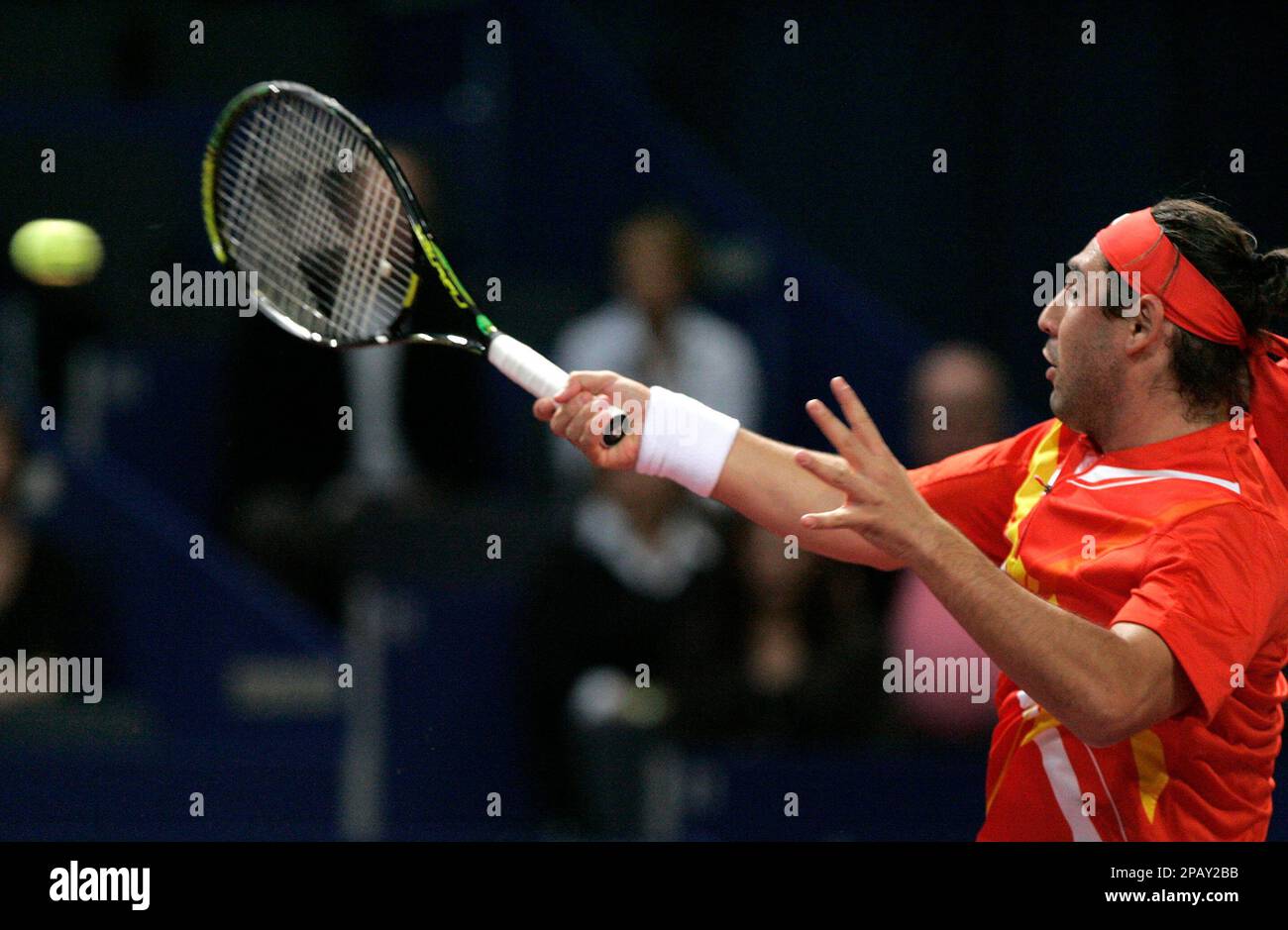 Marcos Baghdatis of Cyprus returns a ball to Jarkko Nieminen of Finland ...