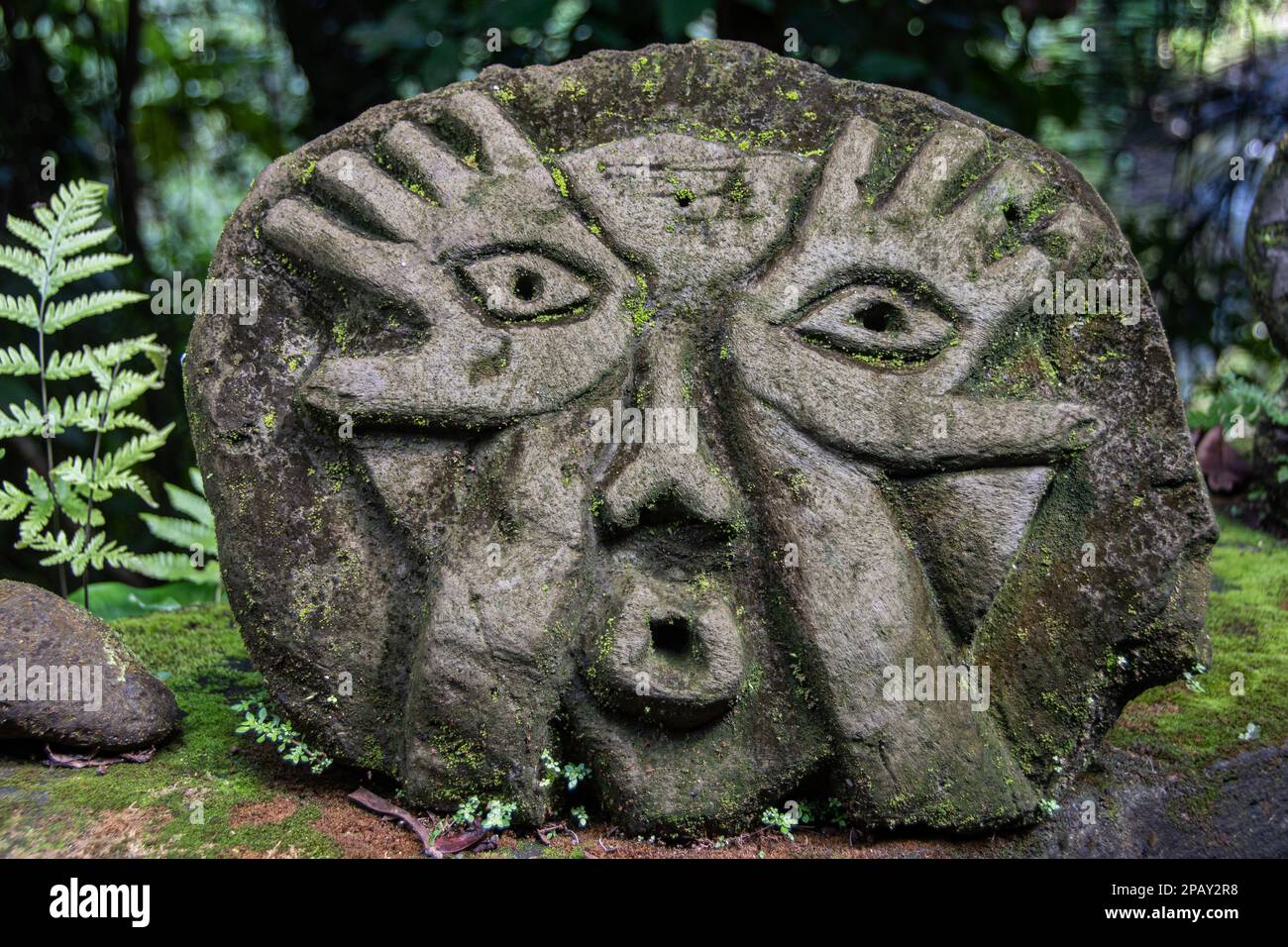 A face carved in a stone Stock Photo - Alamy