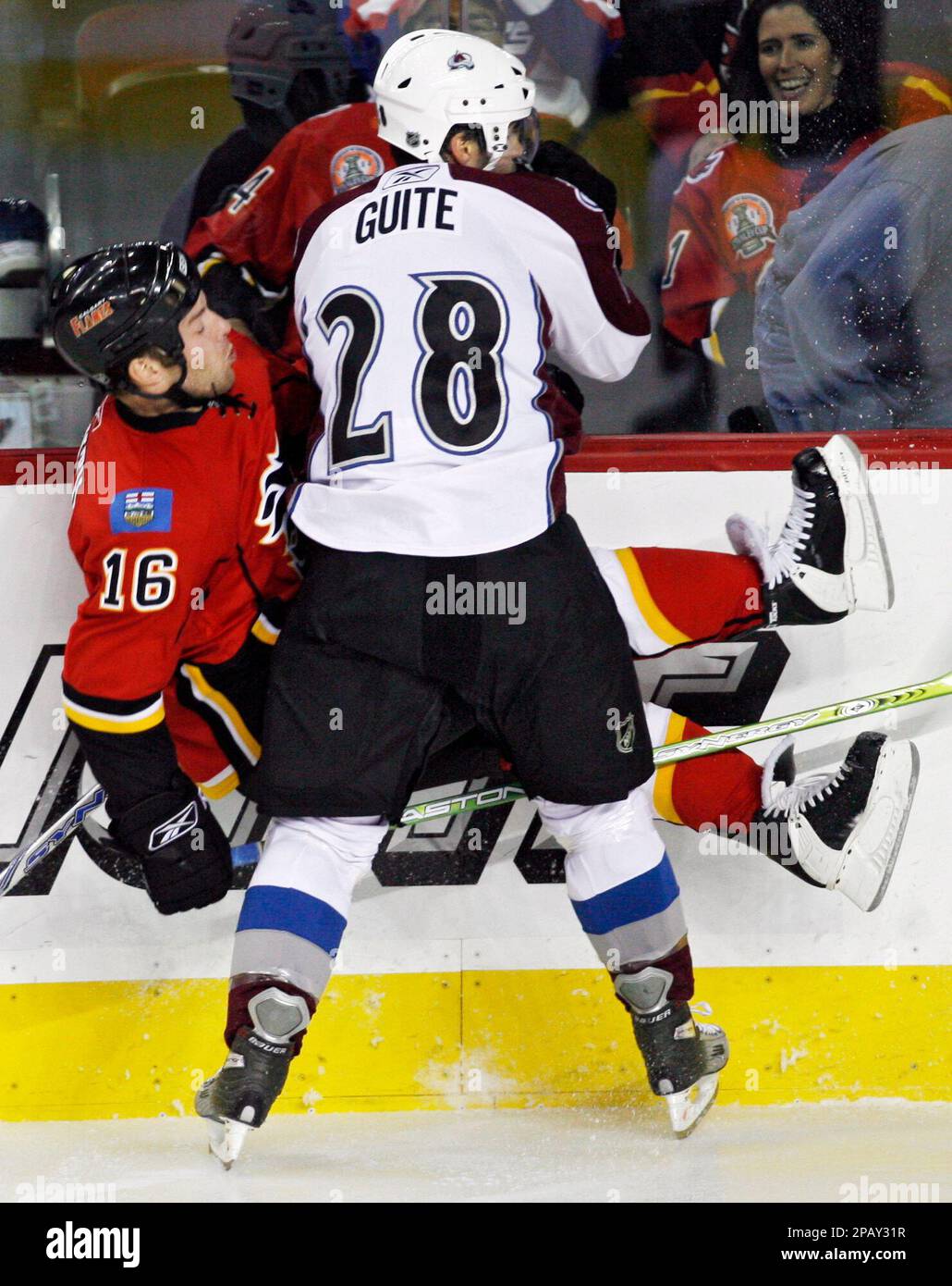 Colorado Avalanche's Ben Guite, right, checks Calgary Flames' Mark ...