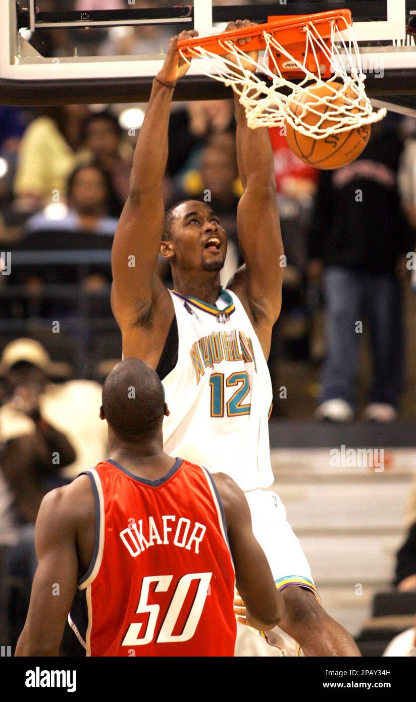 new Orleans Hornets' Hilton Armstrong, right, dunks over Charlotte ...