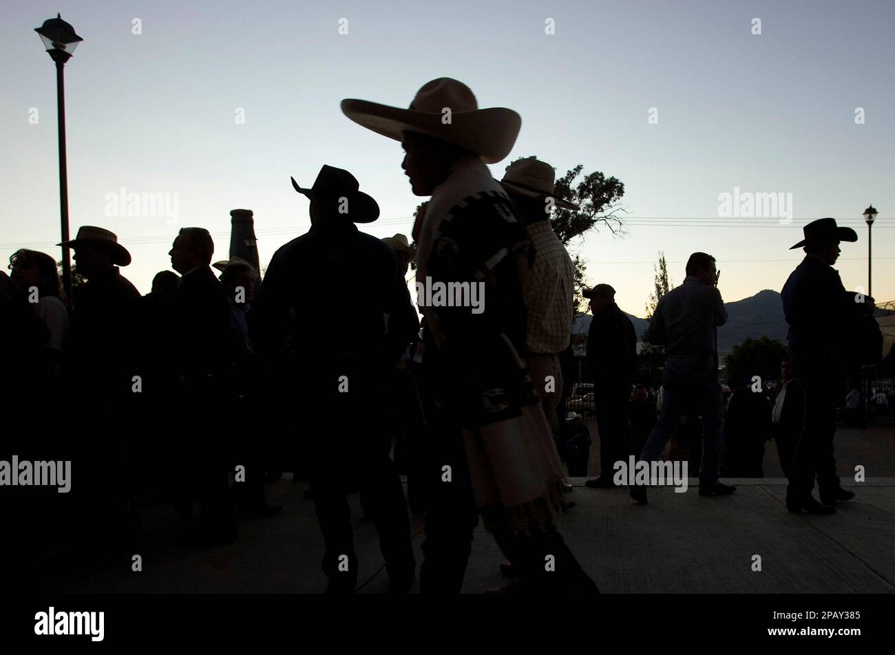 People line up outside the Don Vasco arena to enter the National Charro ...