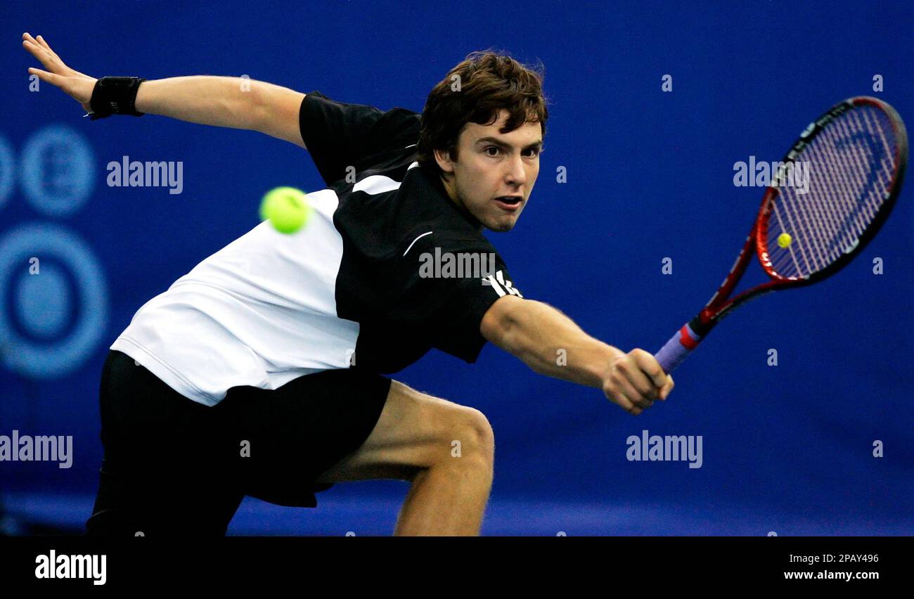 Latvia's Ernest Gulbis returns the ball to Croatia's Marin Cilic during ...