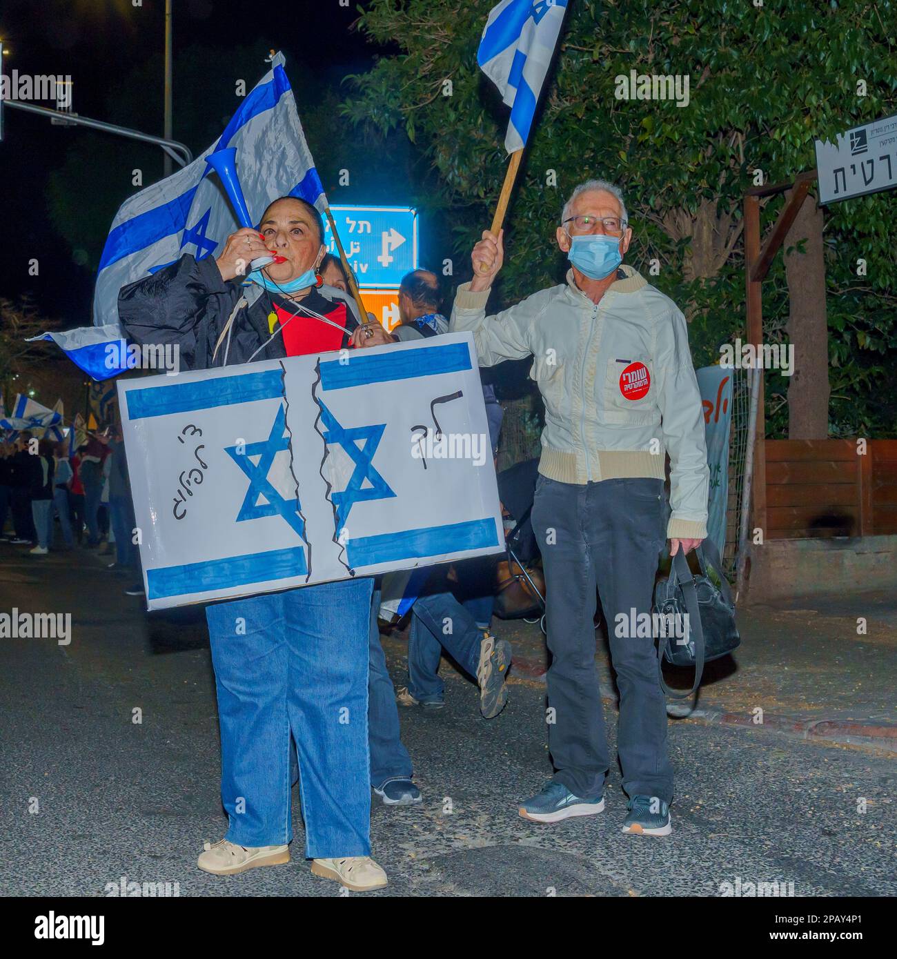 Haifa, Israel - March 11, 2023: Protest march with various signs and ...