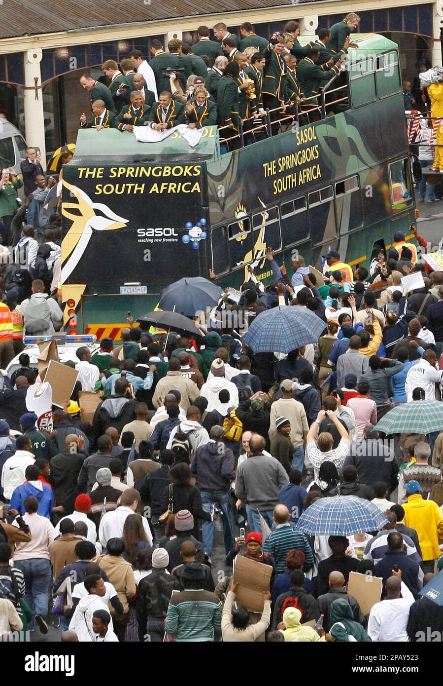 South Africa's rugby team fans cheer as their team parades in in the ...