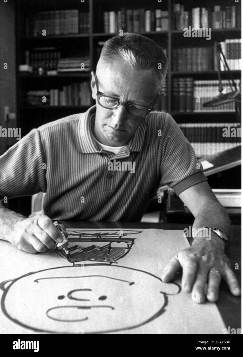 FILE--Cartoonist Charles Schulz draws a picture of his cartoon ...