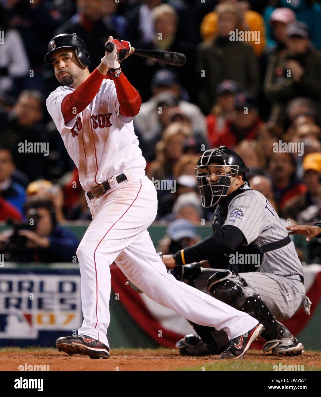 Boston Red Sox's Mike Lowell singles off Colorado Rockies pitcher ...