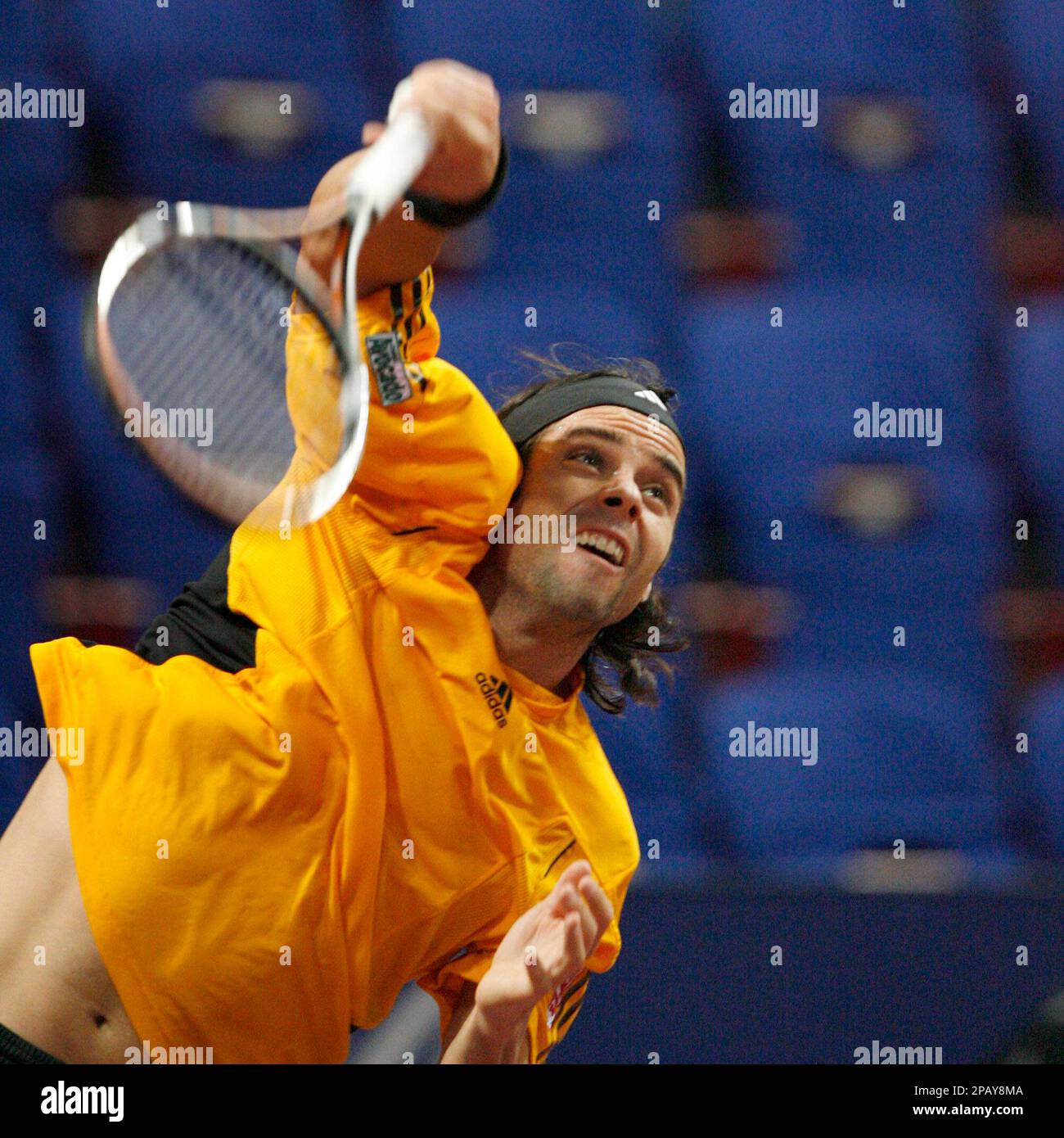 Chile's Fernando Gonzalez returns a ball to Croatia's Roko Karanusic ...