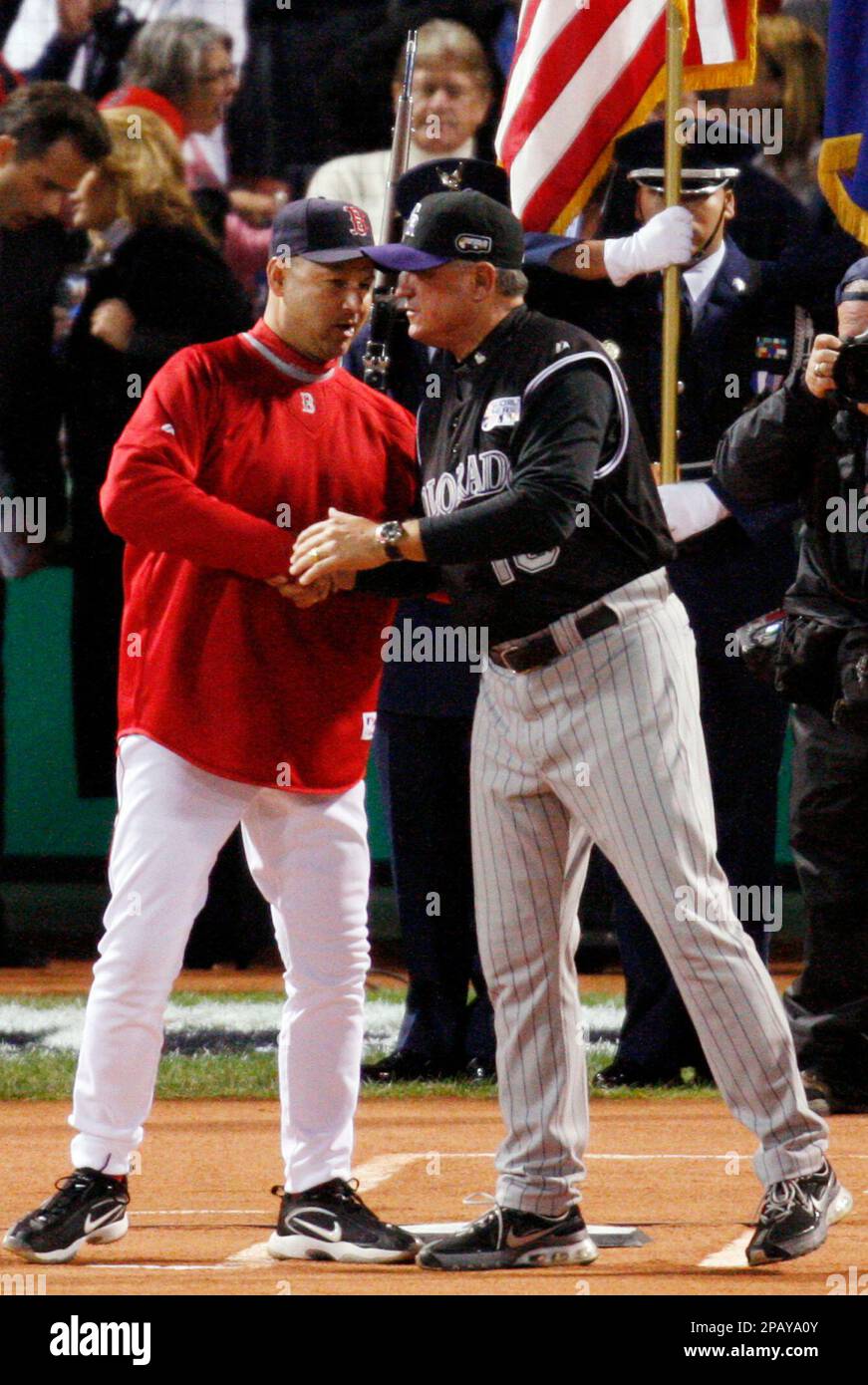 Boston Red Sox manager Terry Francona, left, shakes hands with Colorado ...