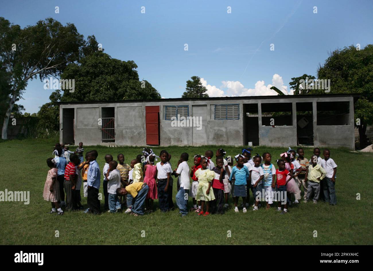 Children from an orphanage wait to participate in activities held by U ...