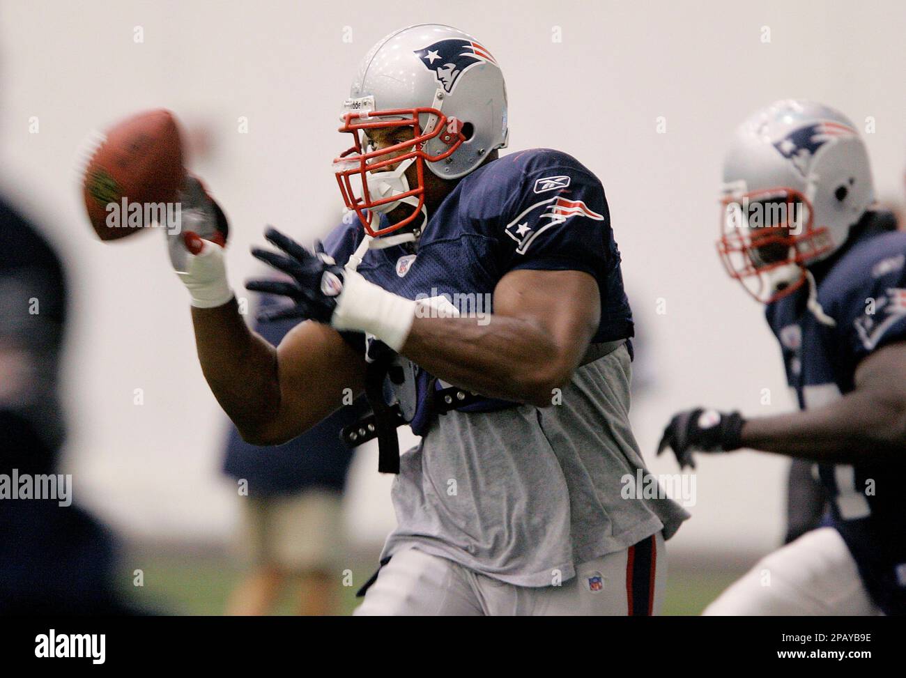 New England Patriots linebacker Adalius Thomas (96) runs through a ball ...
