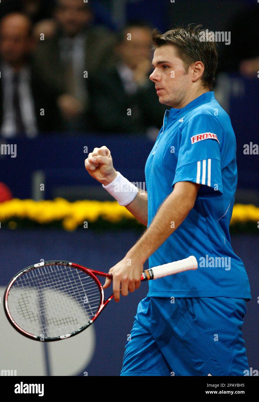 Switzerland's Stanislas Wawrinka cheers after winning the first set ...