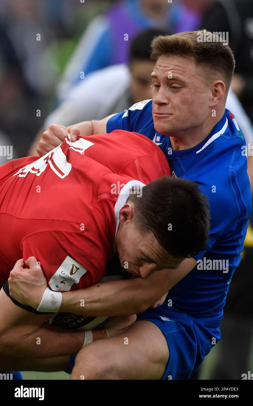 Stephen Varney of Italy (r) tackles Josh Adams of Wales during the Six ...