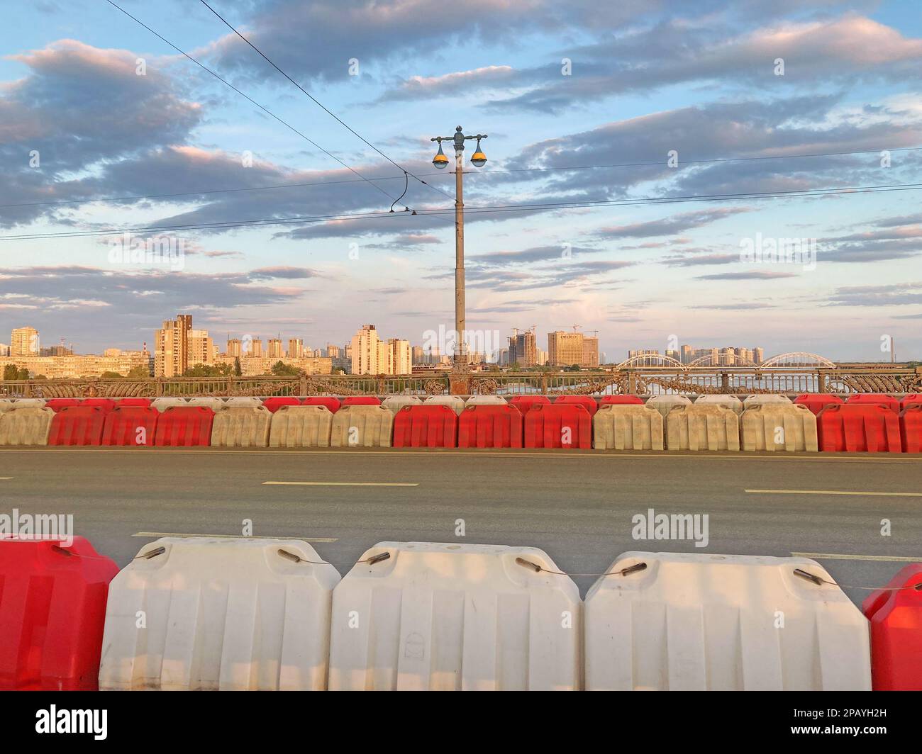 Plastic road barriers filled with red and white water. plastic red and ...