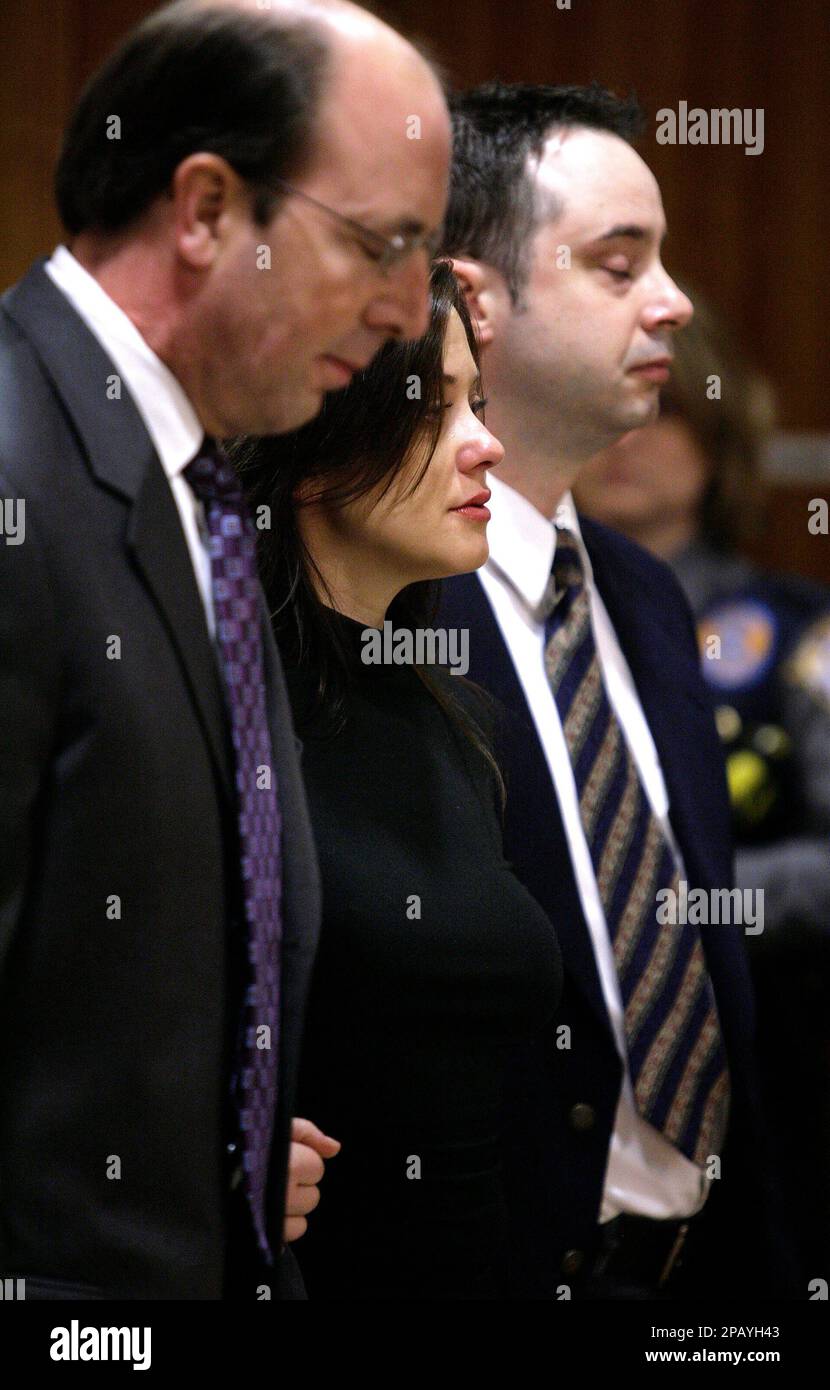 Mechele Linehan, center, stands with her husband Colin Linehan, right ...