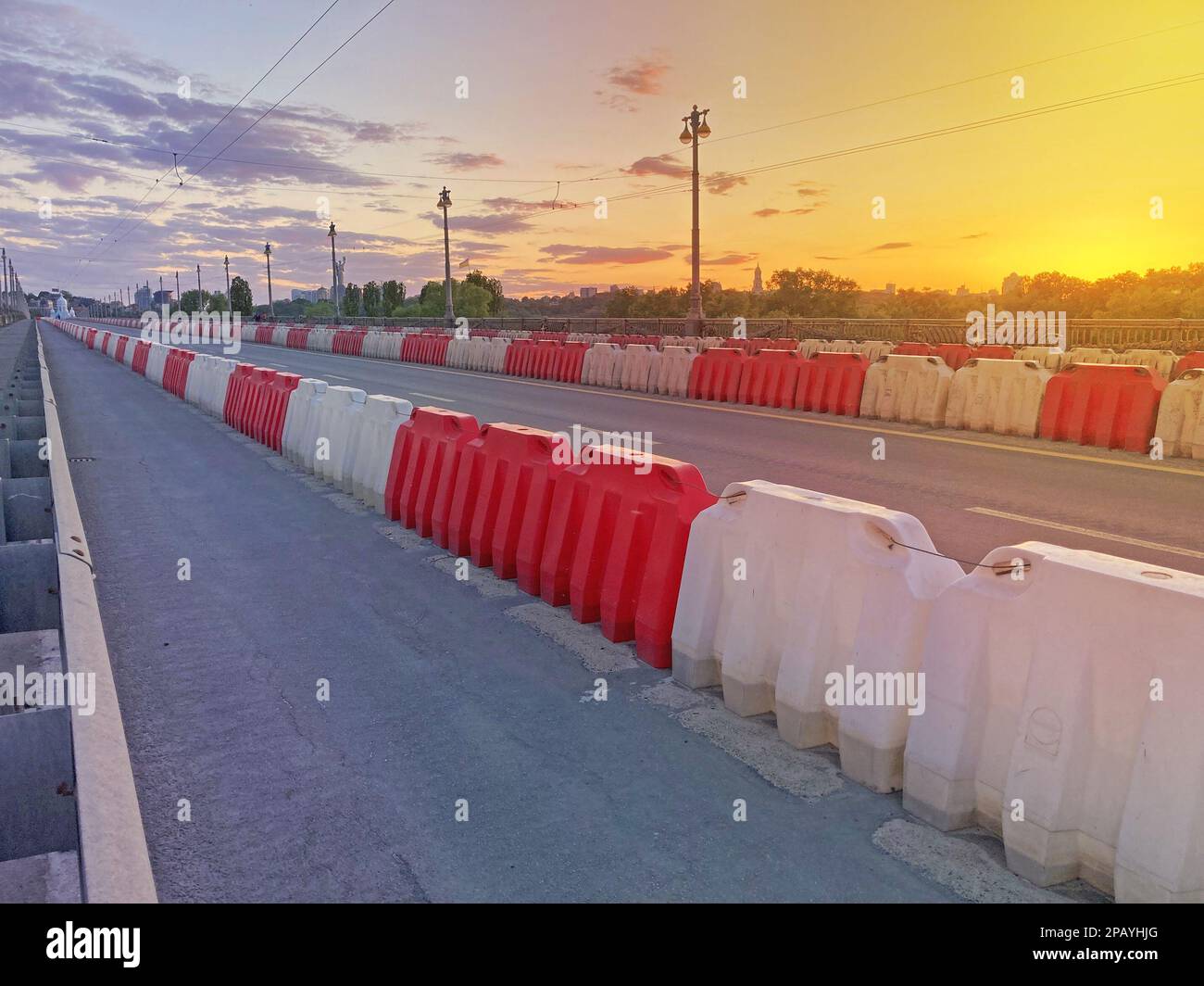 Plastic road barriers filled with red and white water. plastic red and ...