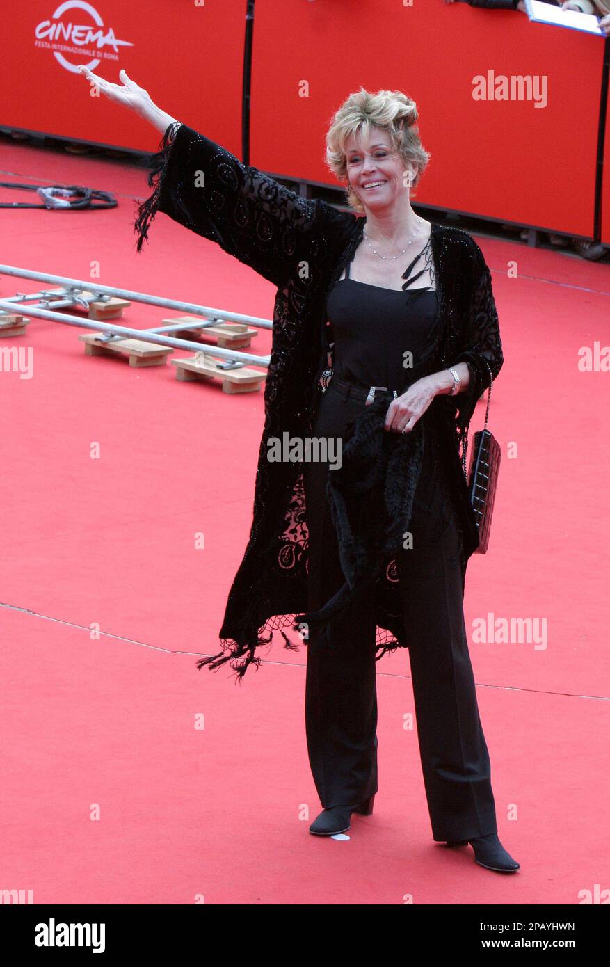 U.S. actress Jane Fonda waves as she arrives for a press conference at ...