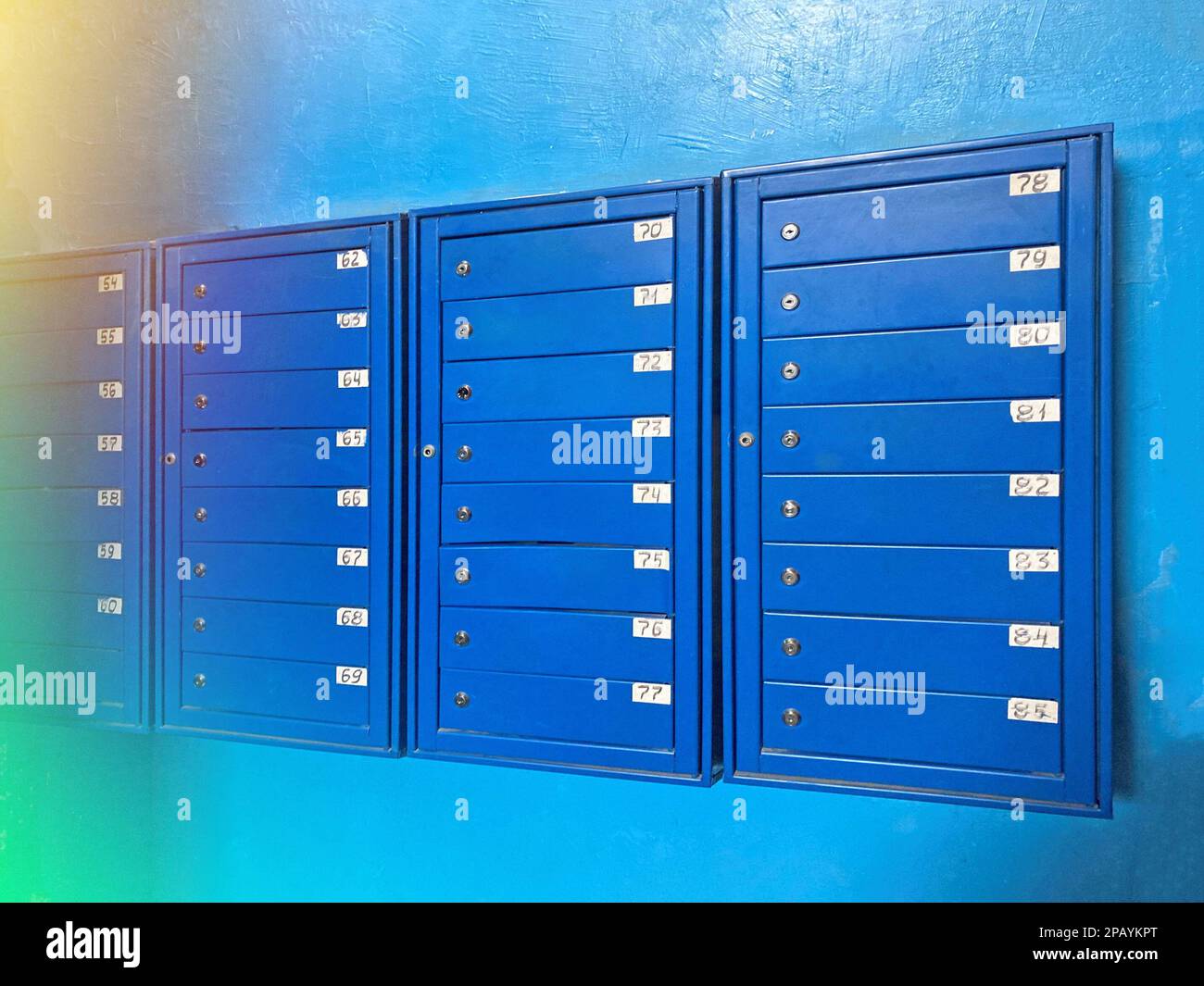 Backdrop of rows of numbered mailbox in modern residential apartments ...