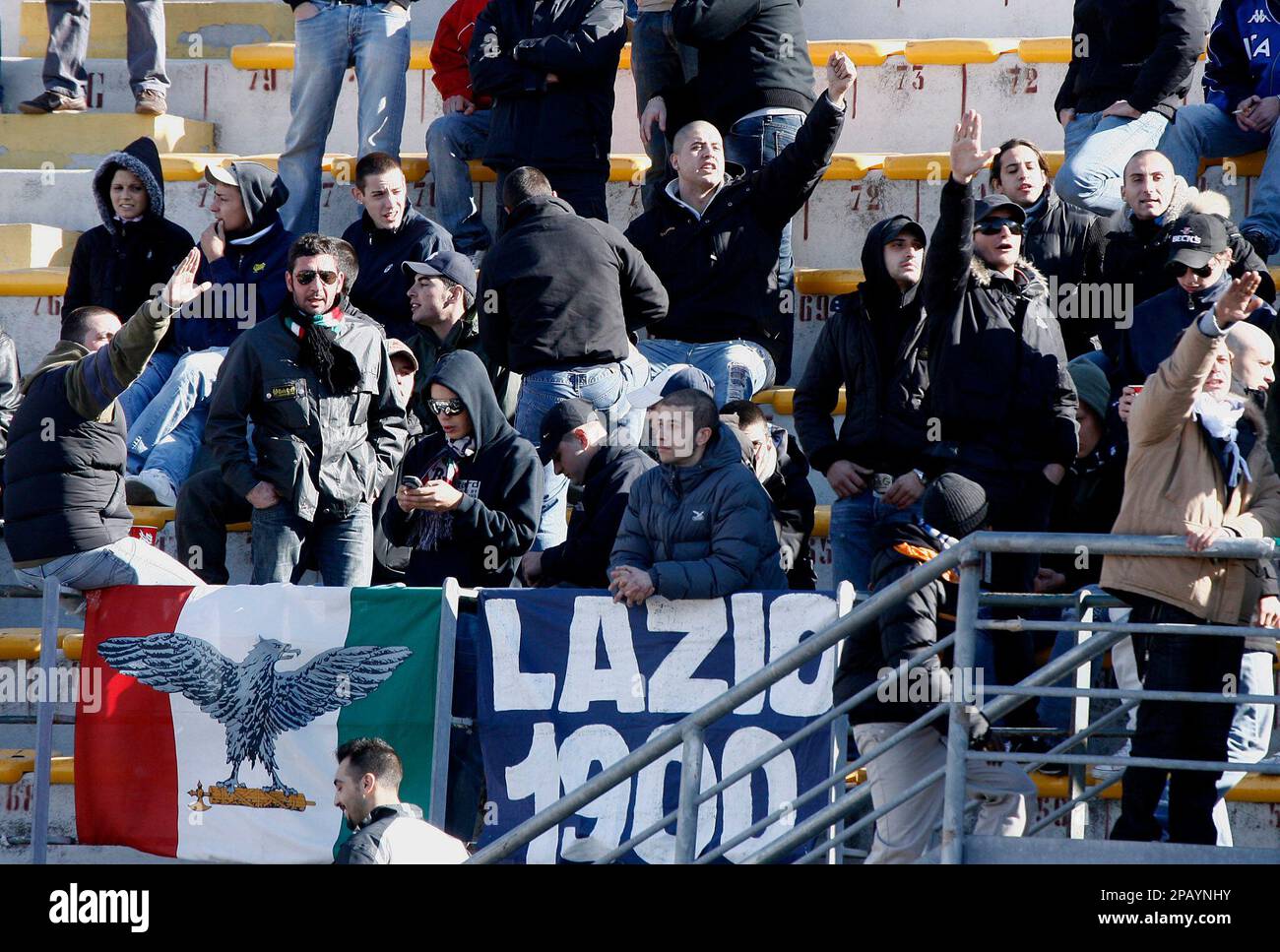 Lazio's supporters show flag and fascist salutes prior to the start of ...