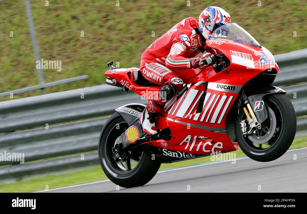 Casey Stoner from Australia, powers his Ducati out of a corner on his ...