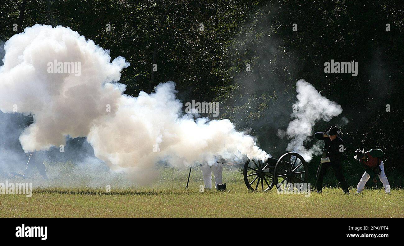 Re-enactors portraying Union Army artillery fire a cannon at ...