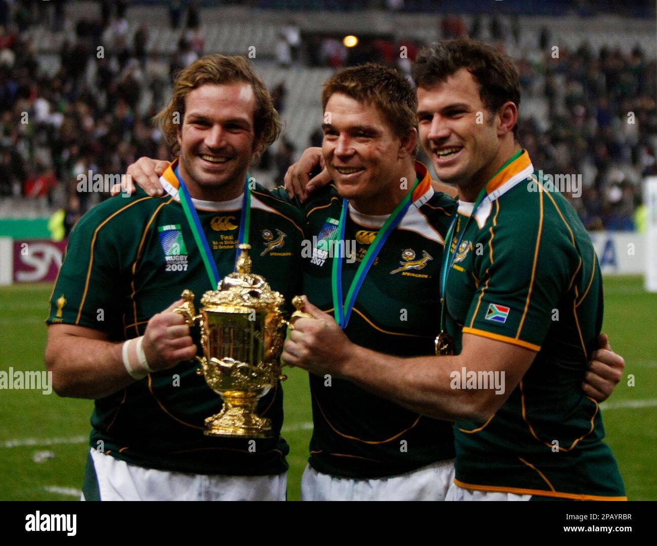 South Africa rugby captain John Smit, center, and unidentified ...