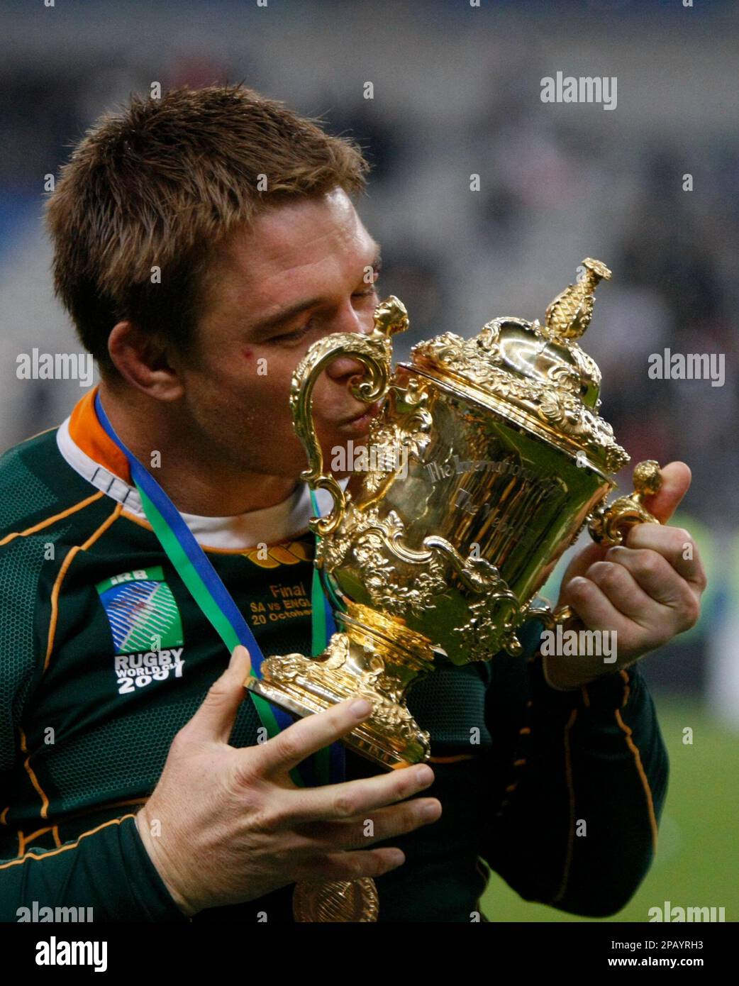 South Africa rugby captain John Smit kisses the trophy as he poses for ...