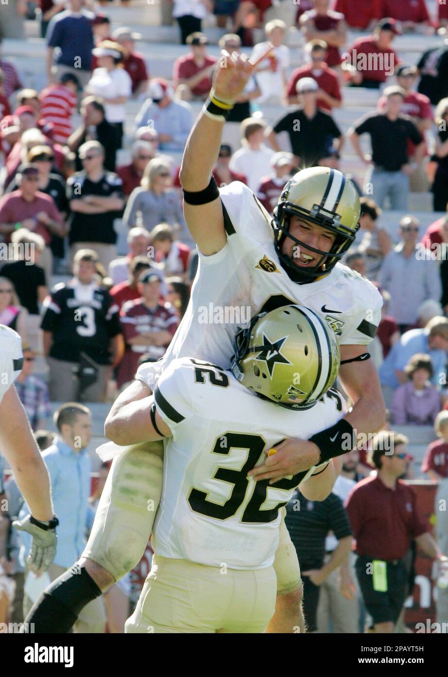 Vanderbilt quarterback Mackenzi Adams (9) celebrates with his teammate ...