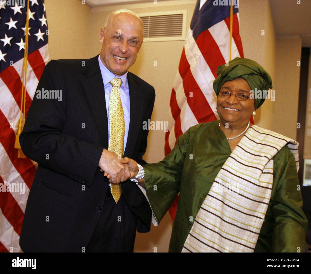 U.S. Treasury Secretary Henry Paulson shake hands with Liberian ...