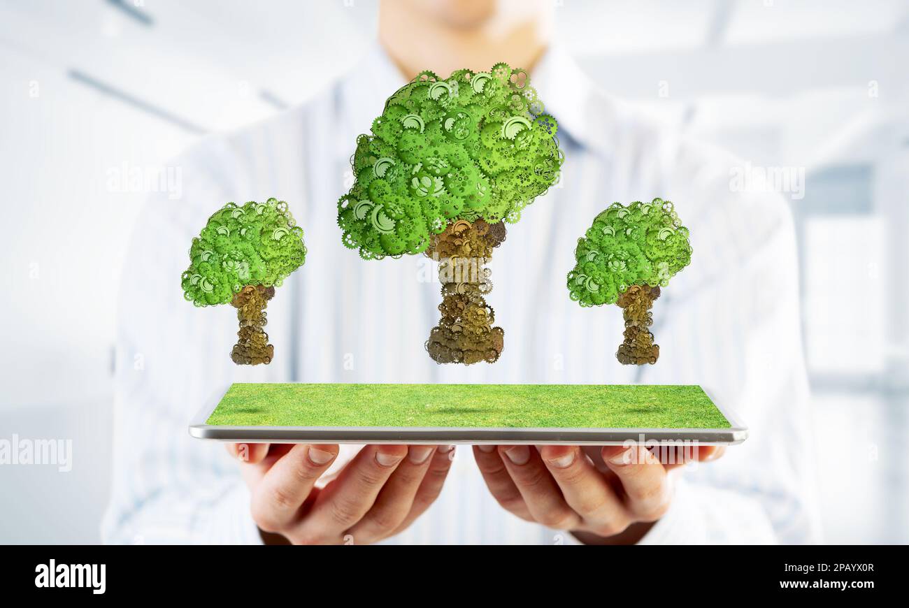 Eco green environment concept presented by tree as working mechanism or ...