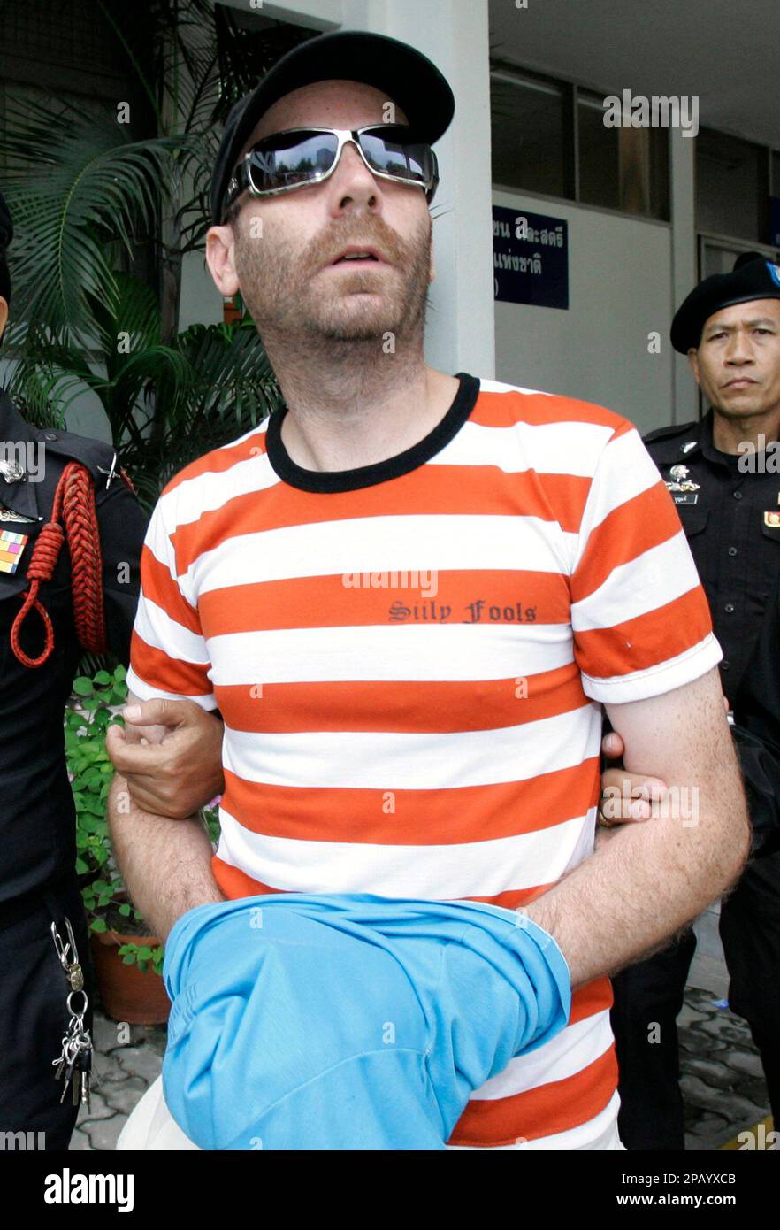 Canadian schoolteacher Christopher Paul Neil looks up as he is escorted ...