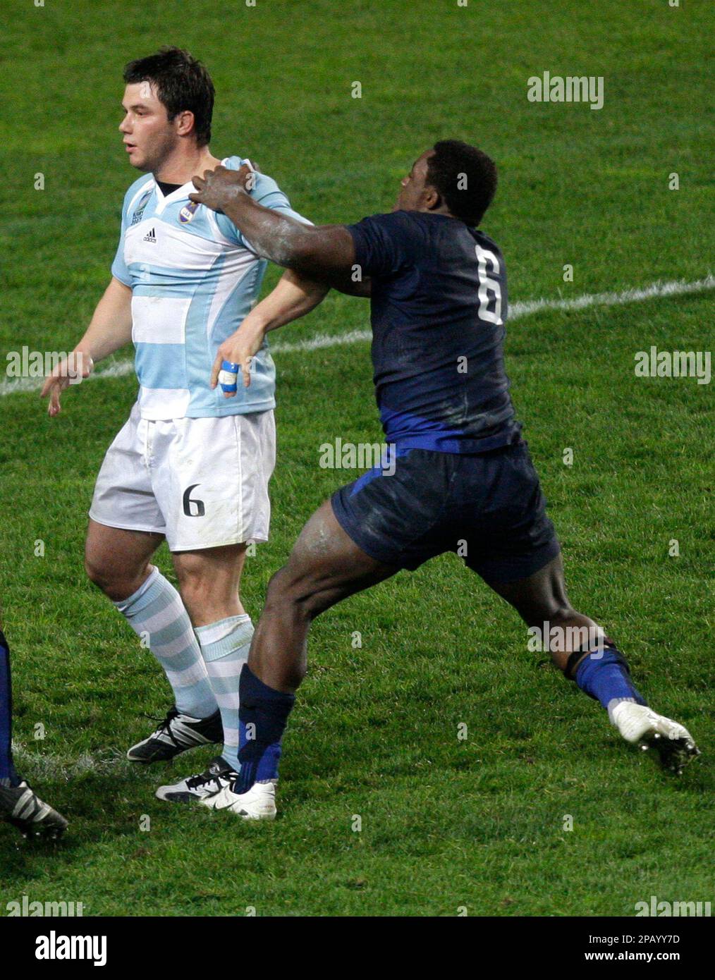 France's Yannick Nyanga, right, grabs Argentina's Martin Durand during ...
