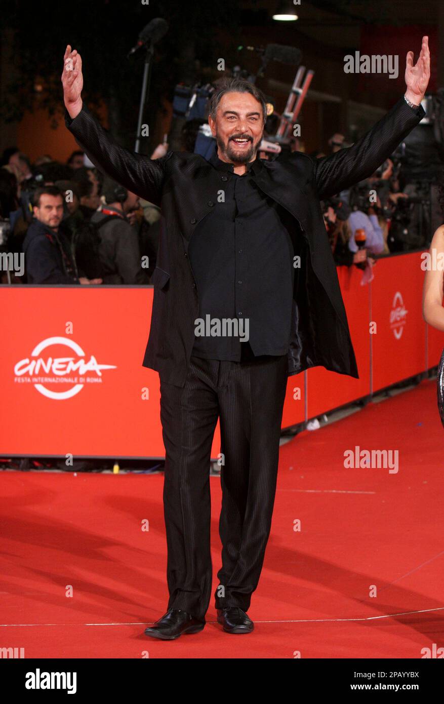 Indian actor Kabir Bedi poses for the photographers upon his arrival ...