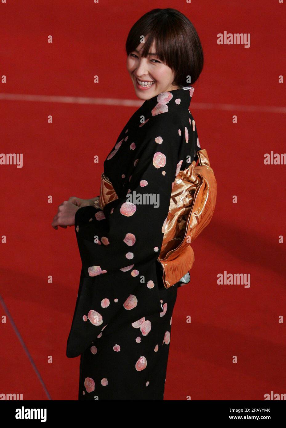 Japanese actress Kumiko Aso smiles on the red carpet for the screening ...
