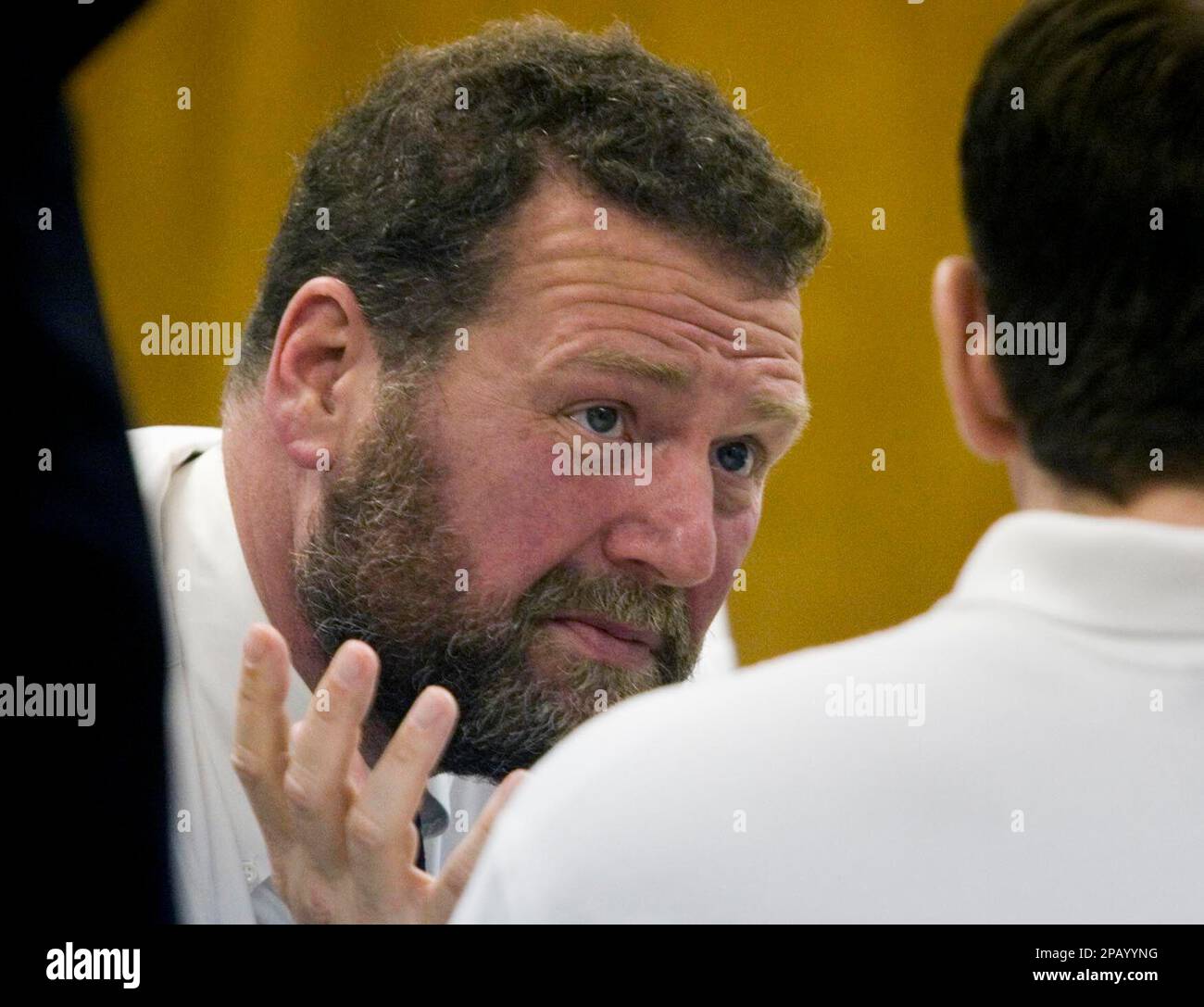 Defense attorney Ron Evans talks to Scott Cheever in the courtroom on ...
