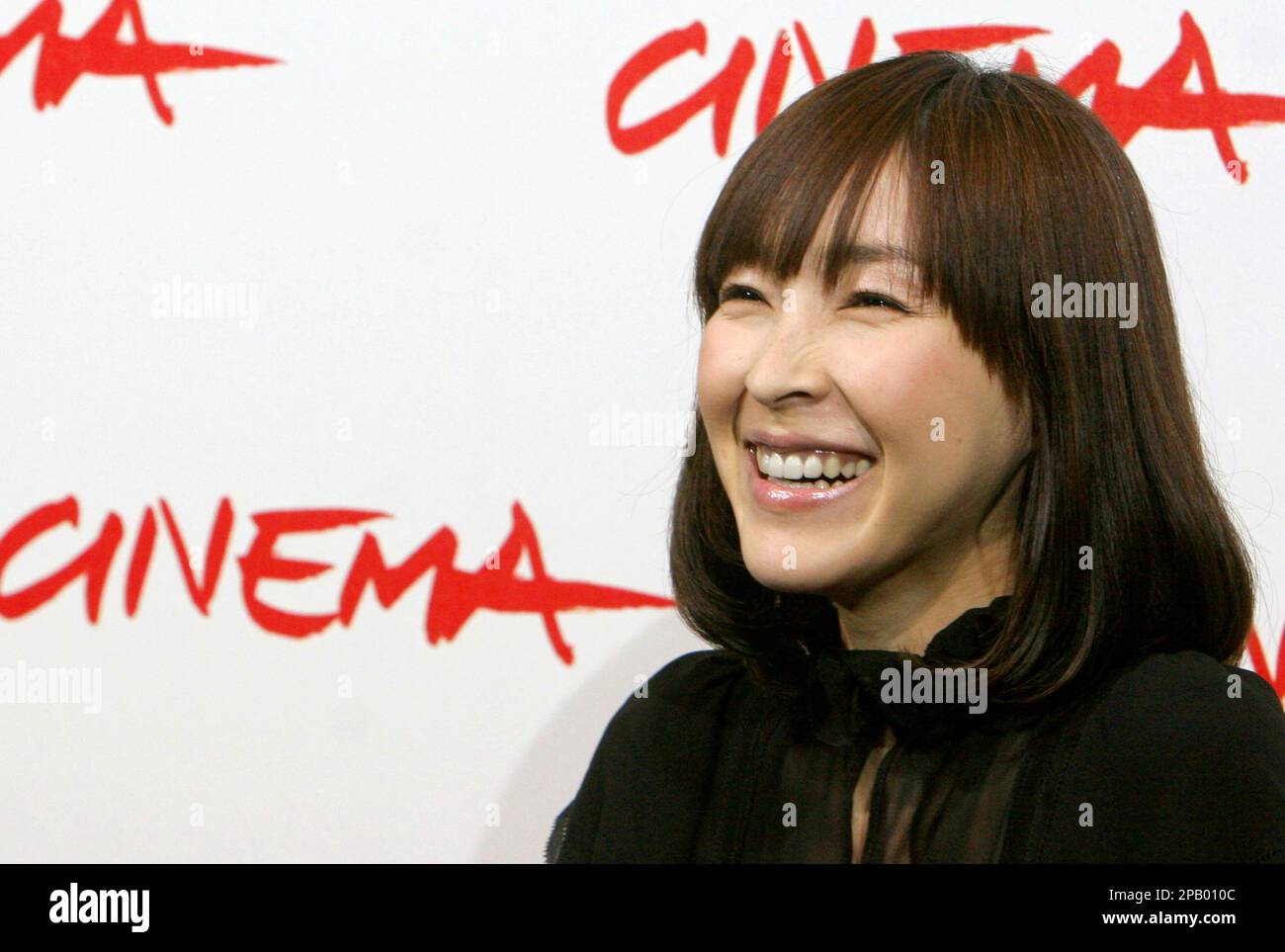 Japanese Actress Kumiko Aso Smiles As She Poses For Photographers