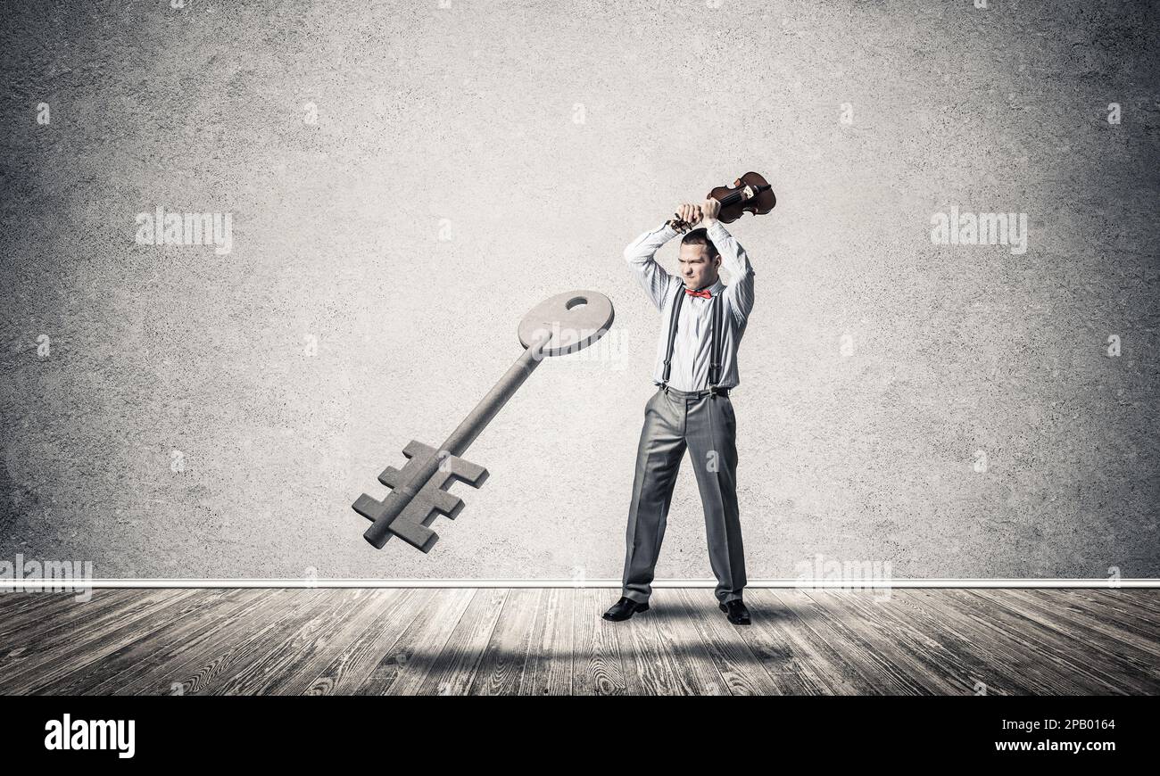 Breaking through access concept with man in room crashing concrete key ...